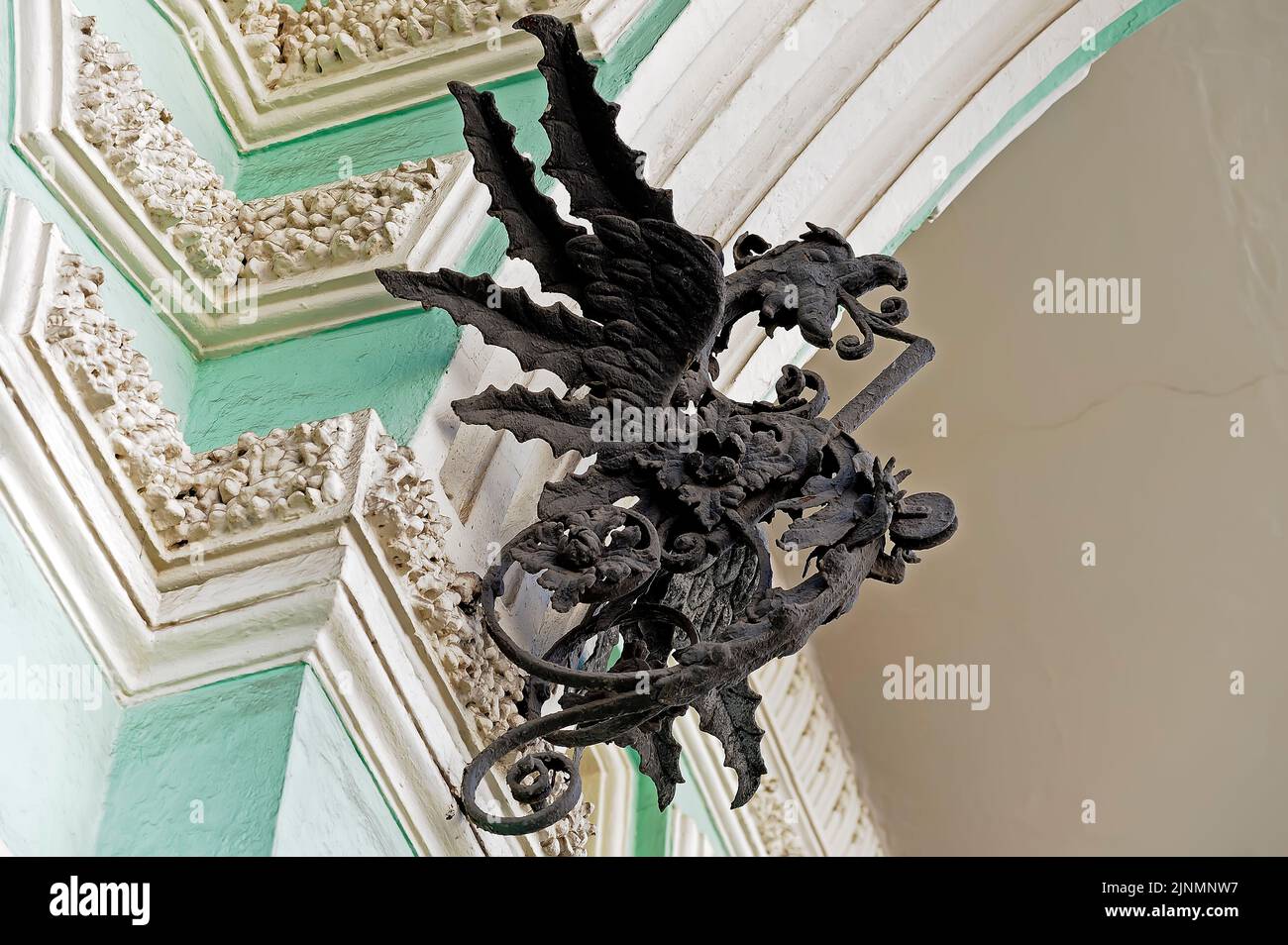 Griffin sculpture side view mounted on a wall of old building in Kyiv ...