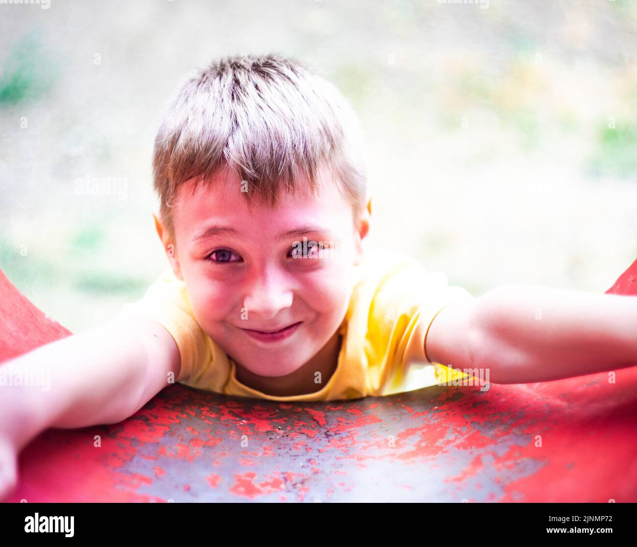 Beautiful boy playing outdoor in the summer park playground Stock Photo ...