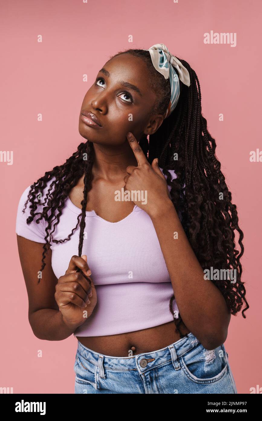 Finger pointing cheek hi-res stock photography and images - Alamy