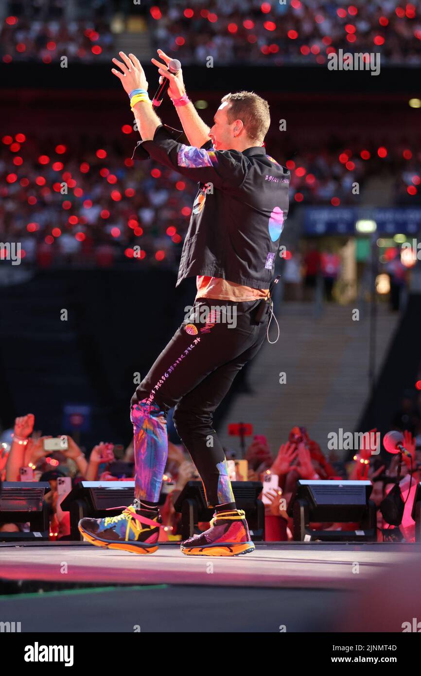 Coldplay's Chris Martin performing on stage at Wembley Stadium, north ...