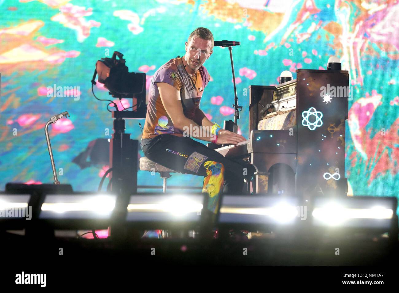 Coldplay's Chris Martin performing on stage at Wembley Stadium, north ...