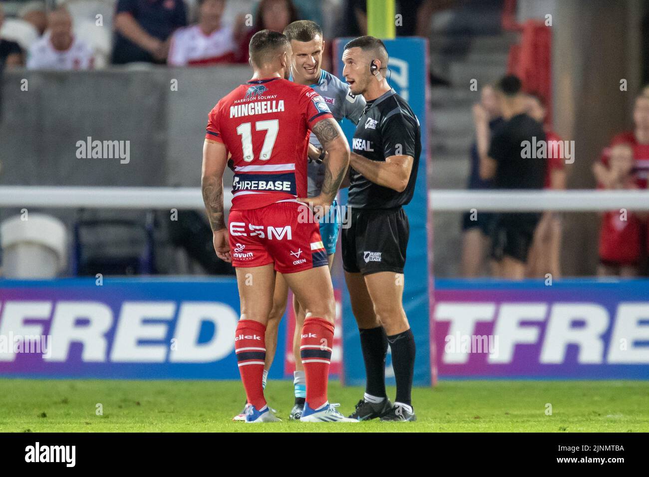 Referee Jack Smith speaks to Ash Handley #5 of Leeds Rhinos and Elliot ...