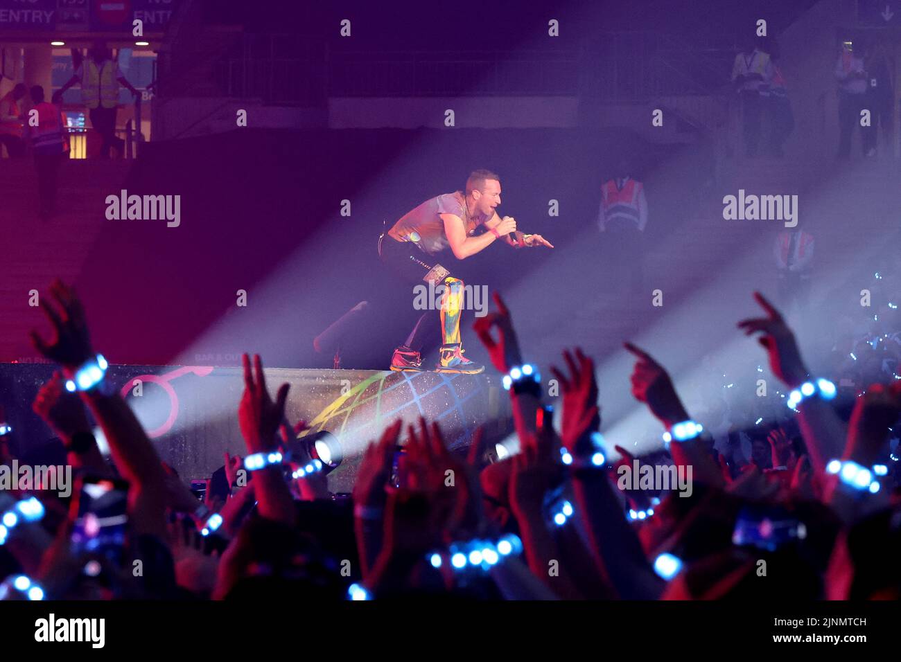 Coldplay's Chris Martin performing on stage at Wembley Stadium, north ...