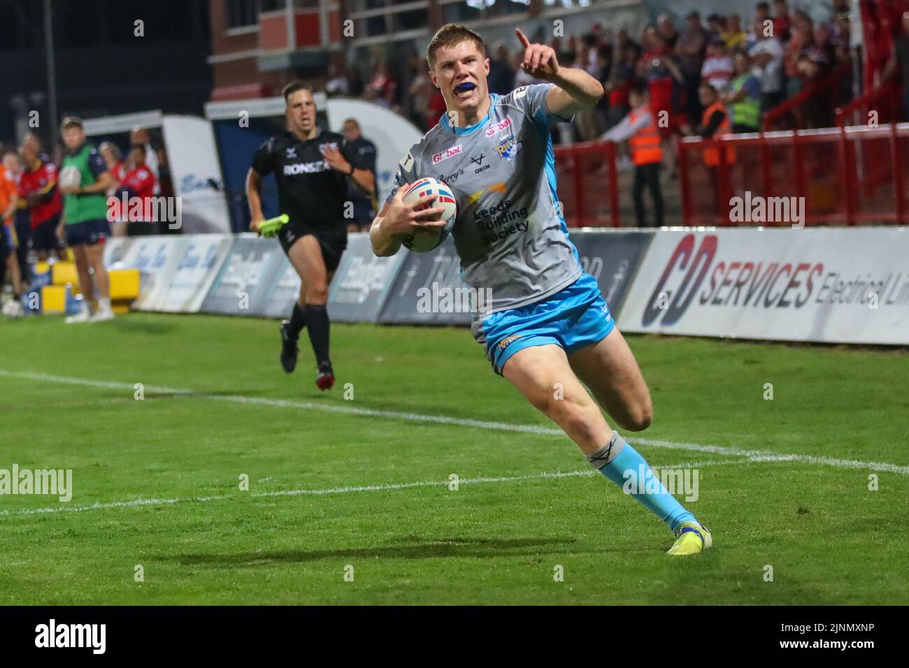 Morgan Gannon #21 of Leeds Rhinos starts to celebrate on his way to ...