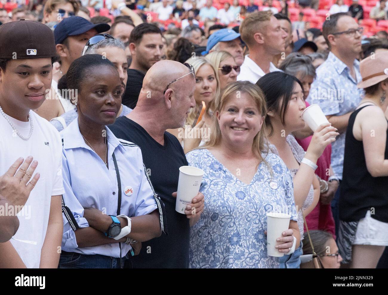 Fans watch Coldplay performing on stage at Wembley Stadium, north ...