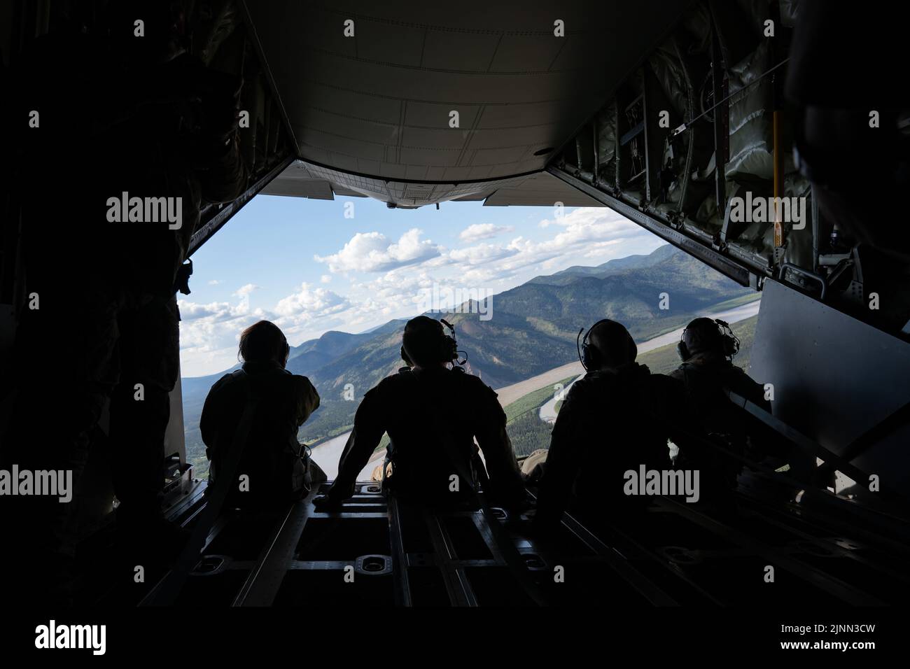 U.S Air Force Airmen assigned to Kadena Air Base Japan sit on the ramp ...