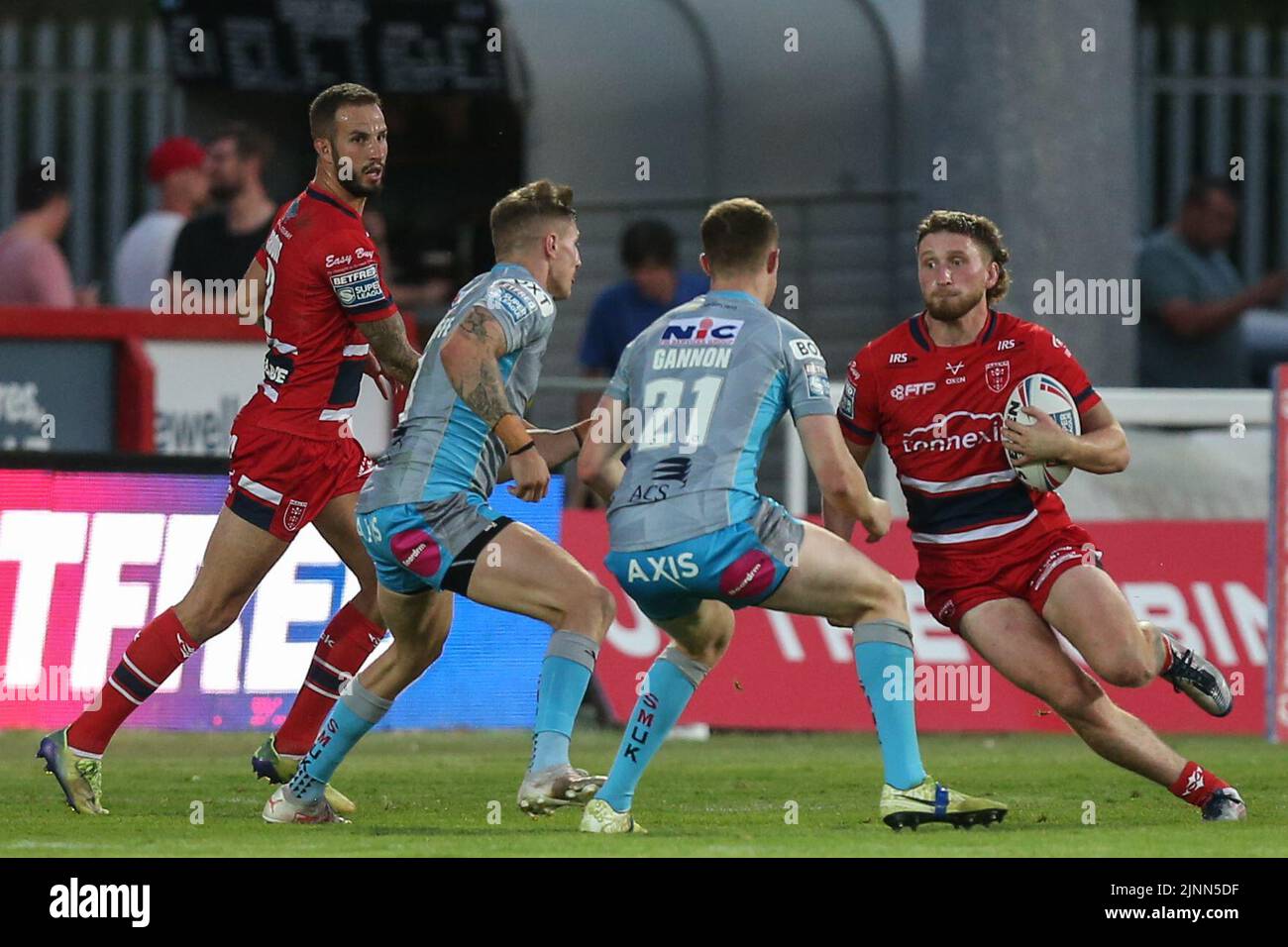 Ethan Ryan #23 of Hull KR runs at the Leeds defence Stock Photo - Alamy