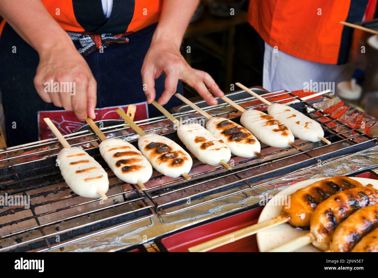 Grilled rice on a stick festival Tokyo Japan Stock Photo - Alamy