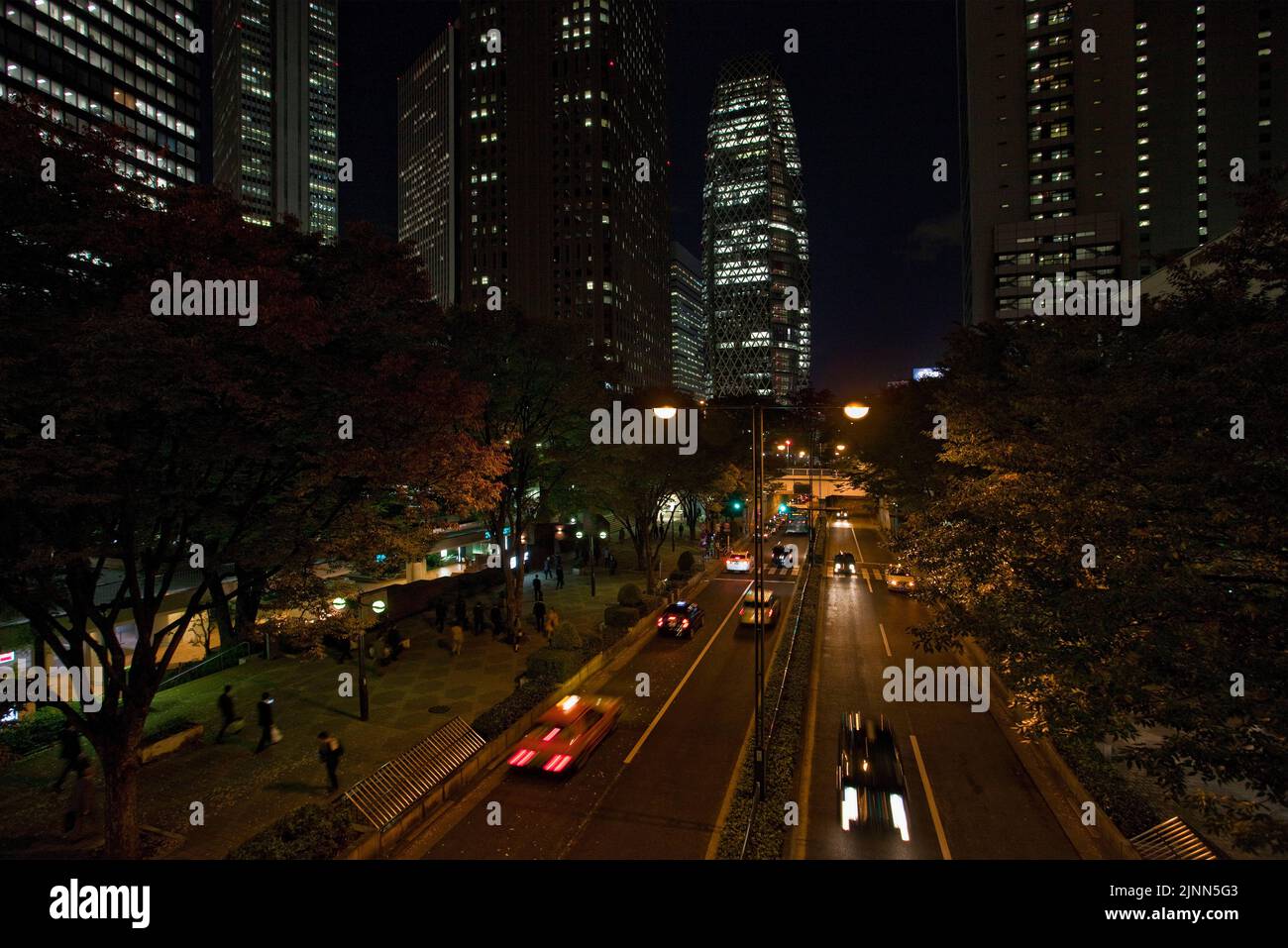 High-rise buildings Cocoon Tower traffic evening Shinjuku Tokyo Japan ...