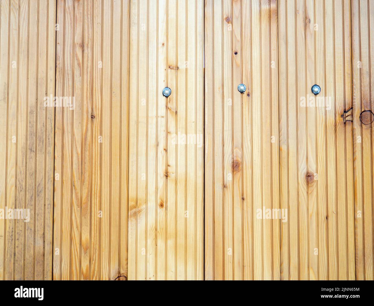 Plank wall. Nailed planks of light wood. Beautiful wood. Background of ...