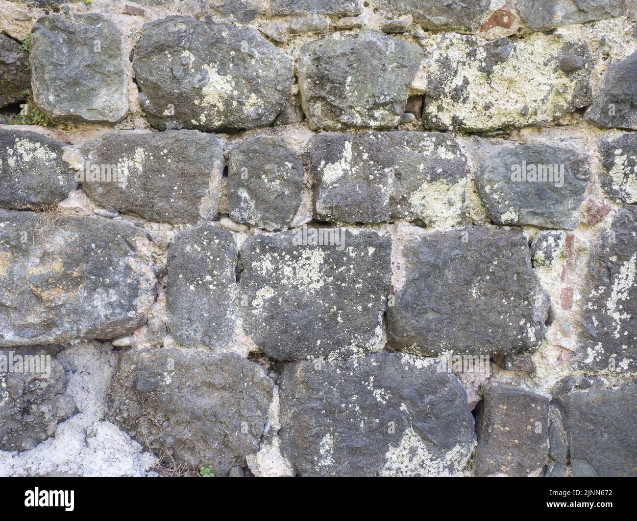 Antique stone wall. Background from a gray stone. The architecture of ...
