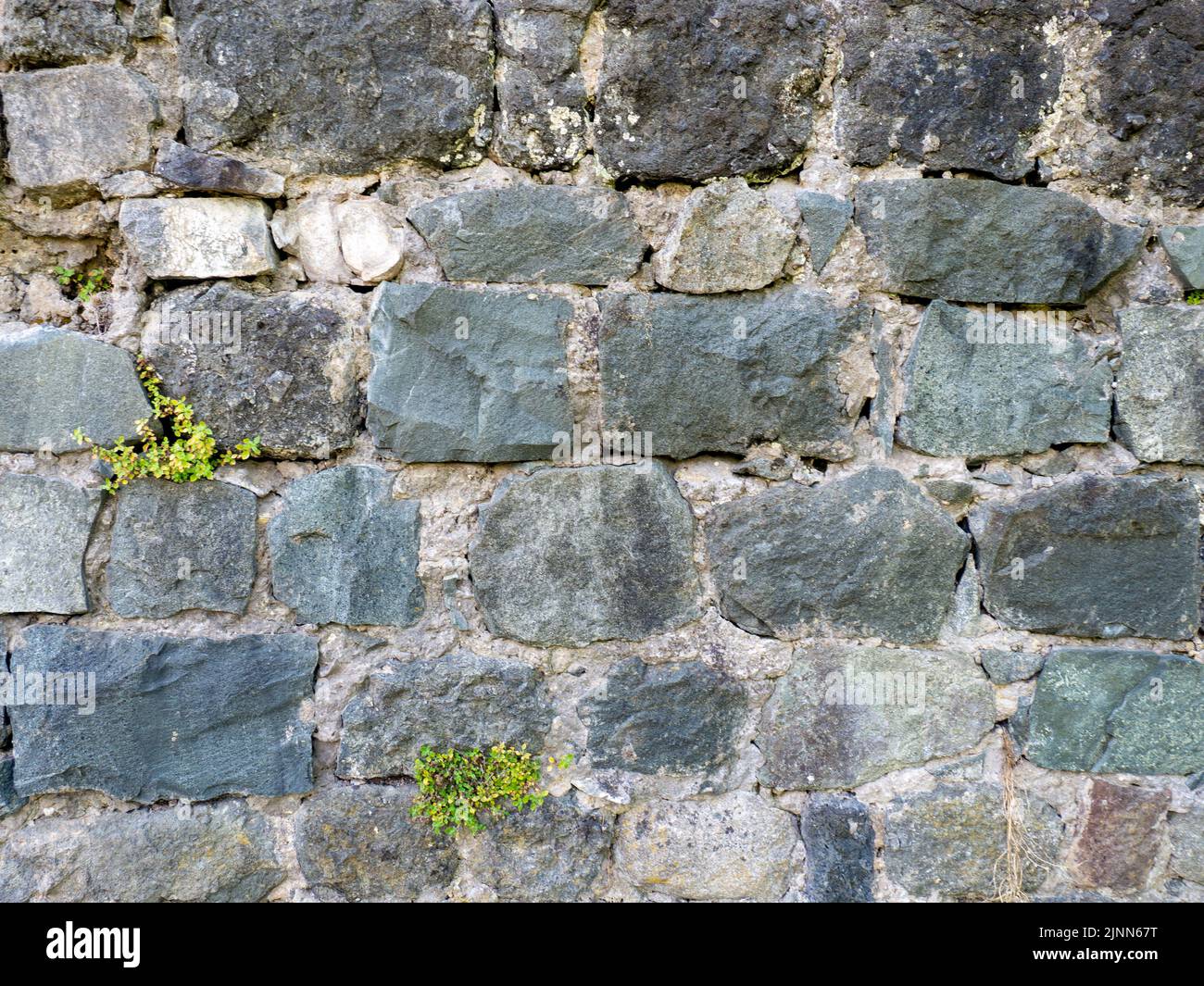 Antique stone wall. Background from a gray stone. The architecture of ...