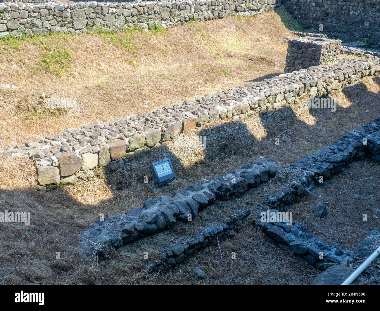 The foundation of an ancient building. Archeology. Ruins of an ancient ...