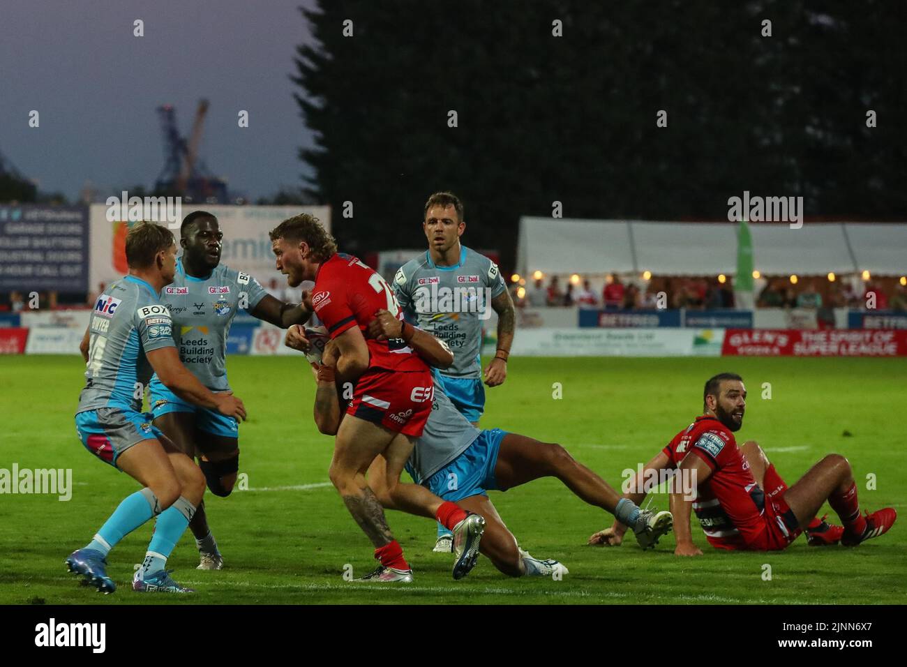 Ethan Ryan #23 of Hull KR is tackled by the Leeds defence Stock Photo ...