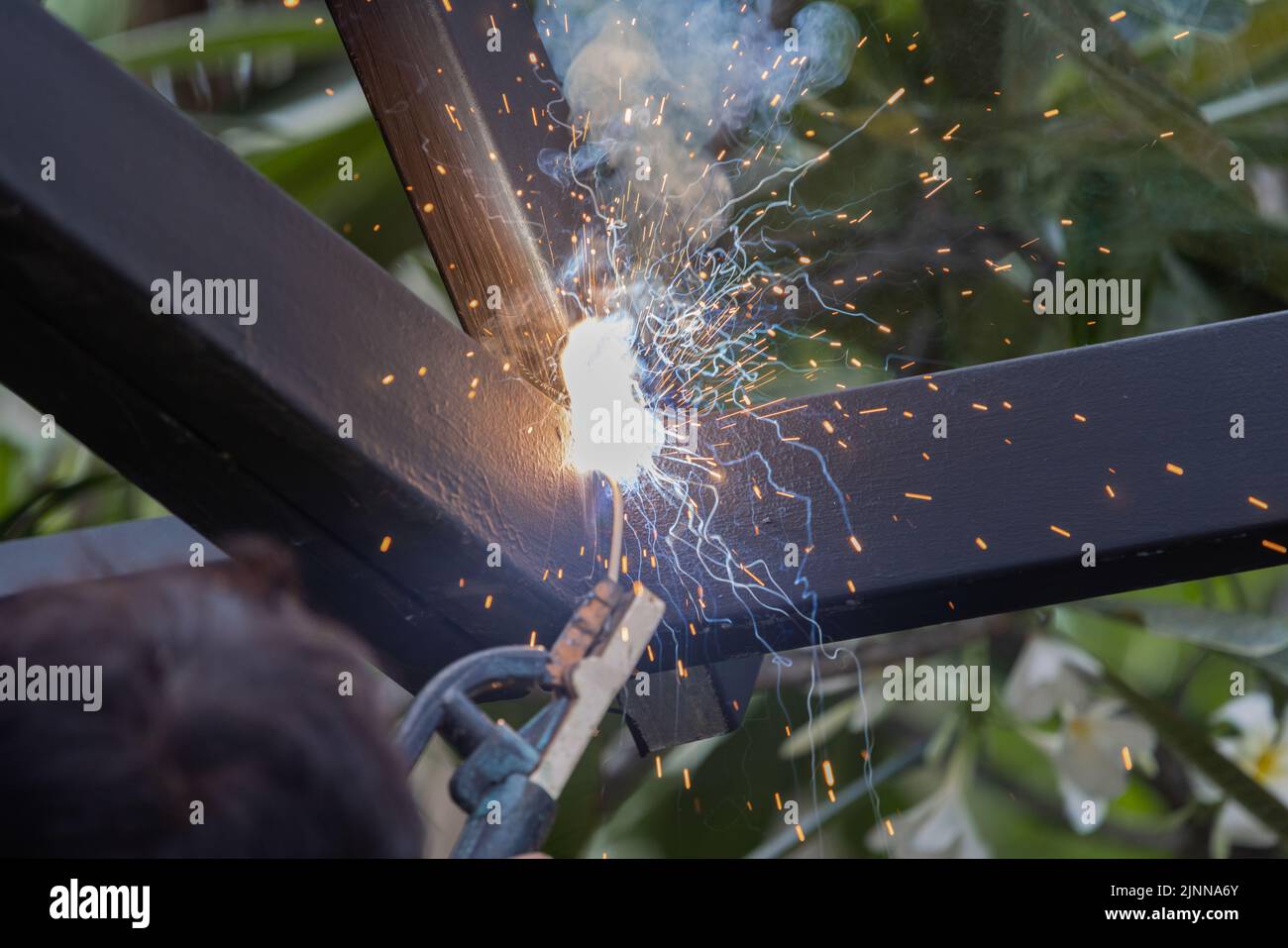 worker welding steel pipe in construction site Stock Photo - Alamy
