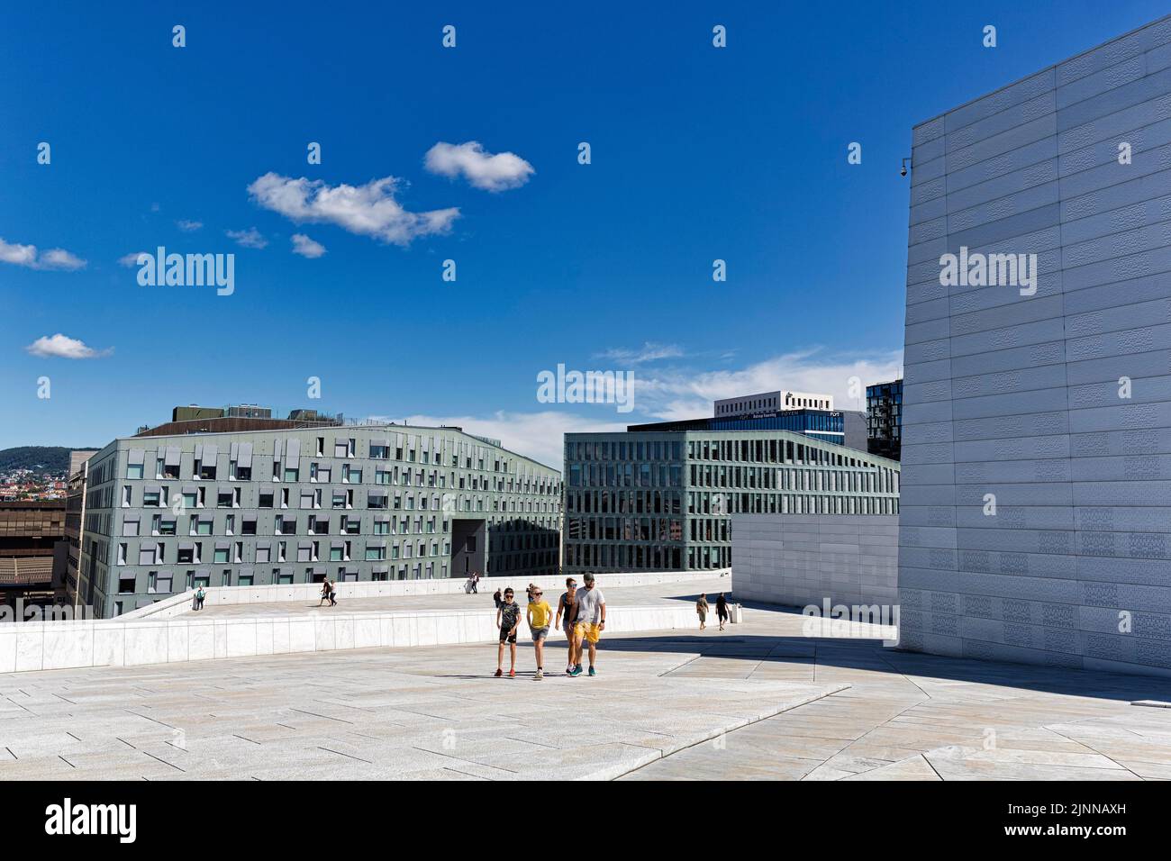 Pedestrians on the white roof of the opera house, modern architecture ...