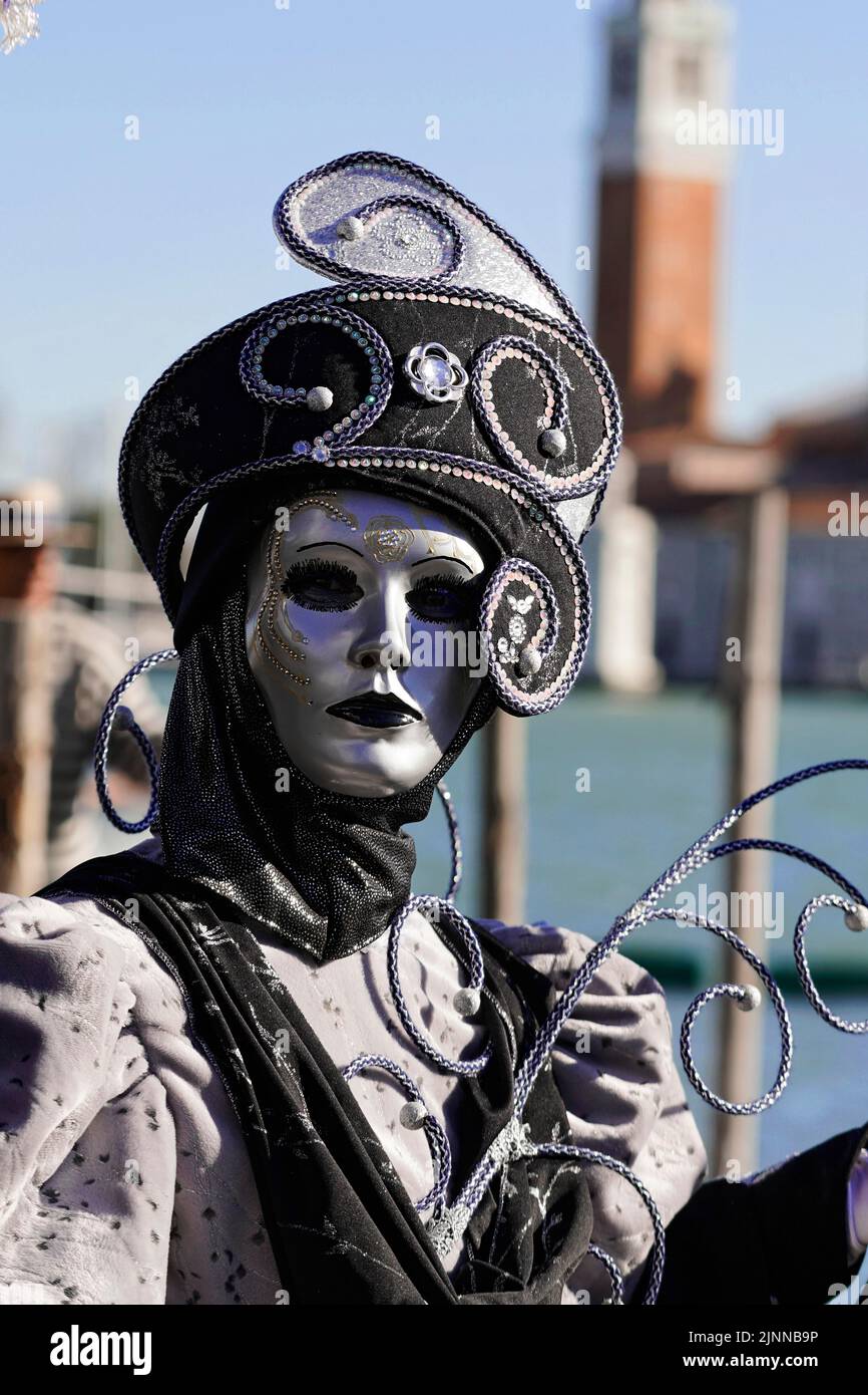 Costumed man with traditional Venetian mask, Venice Carnival, Veneto ...