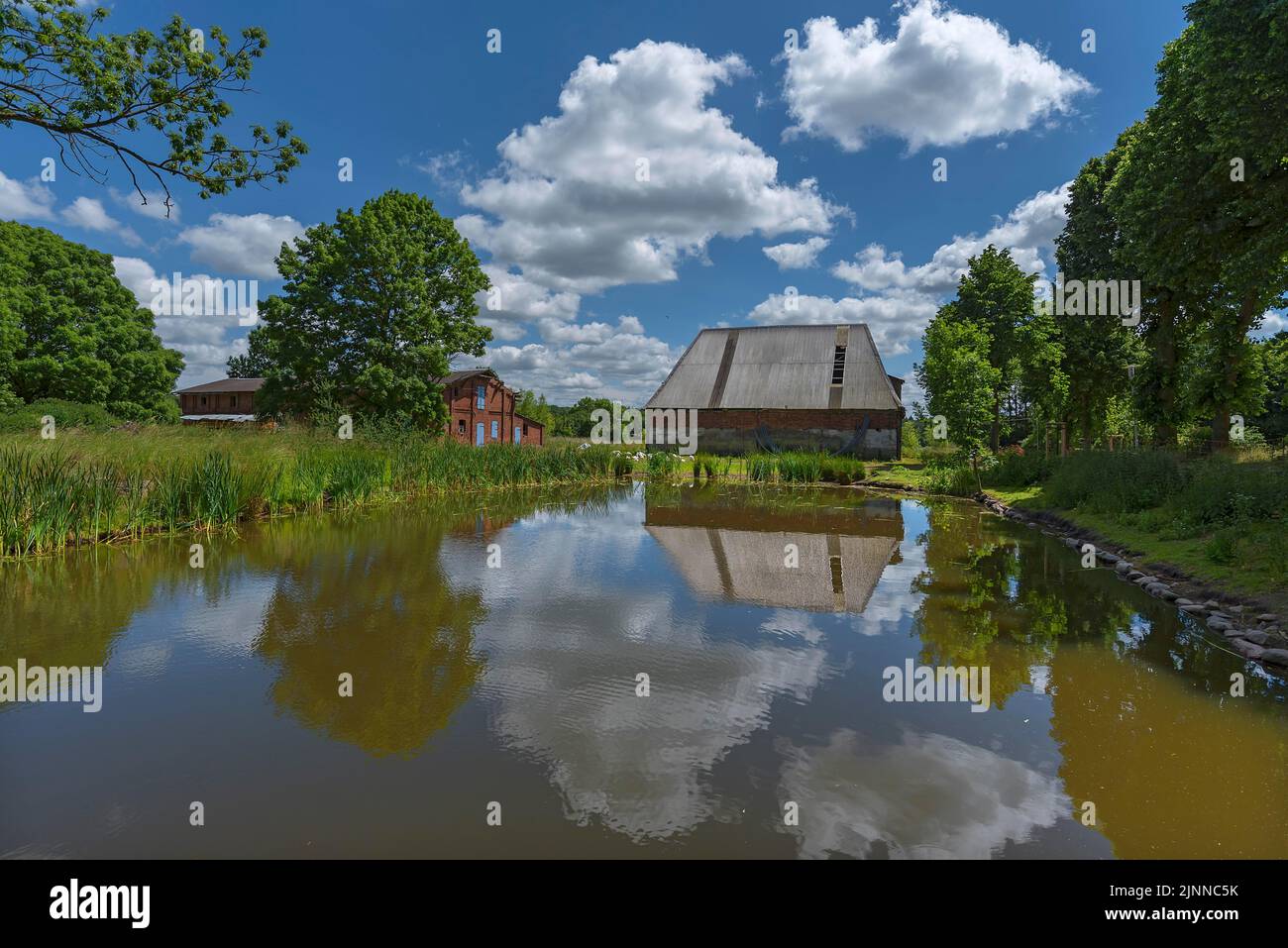 Pond with former stables from the manor house, Mecklenburg-Western ...