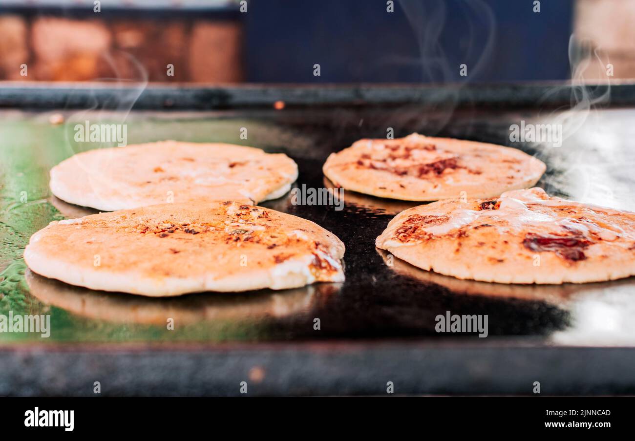 Traditional grilled cheese pupusas, Close up of four traditional ...