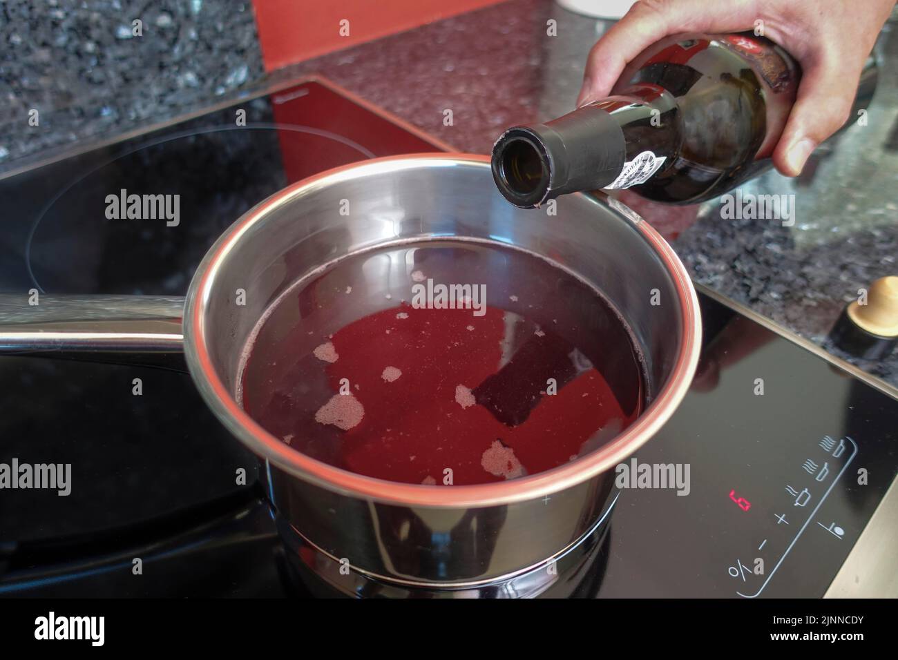 Swabian cuisine, preparing sweet semolina dumplings with cherry compote ...