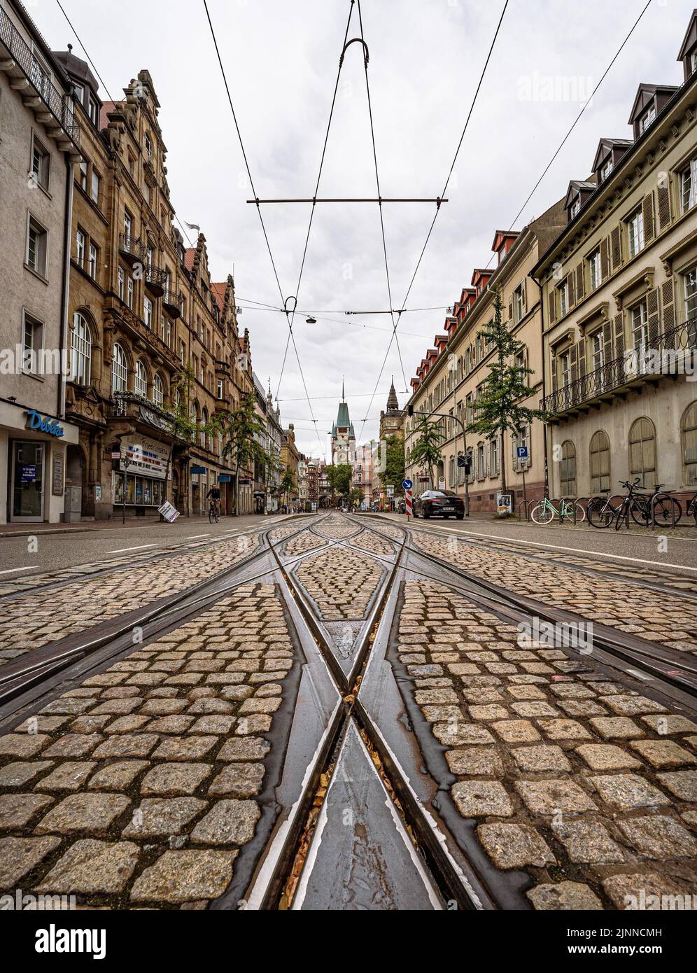 Tram network on Freiburg cobblestone streets, Freiburg, Germany Stock ...