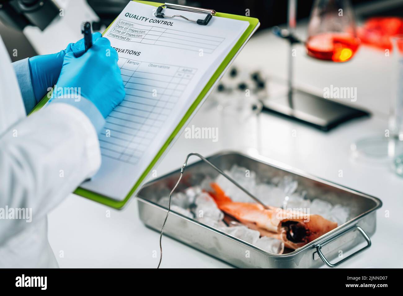 Quality control inspector testing fish Stock Photo - Alamy