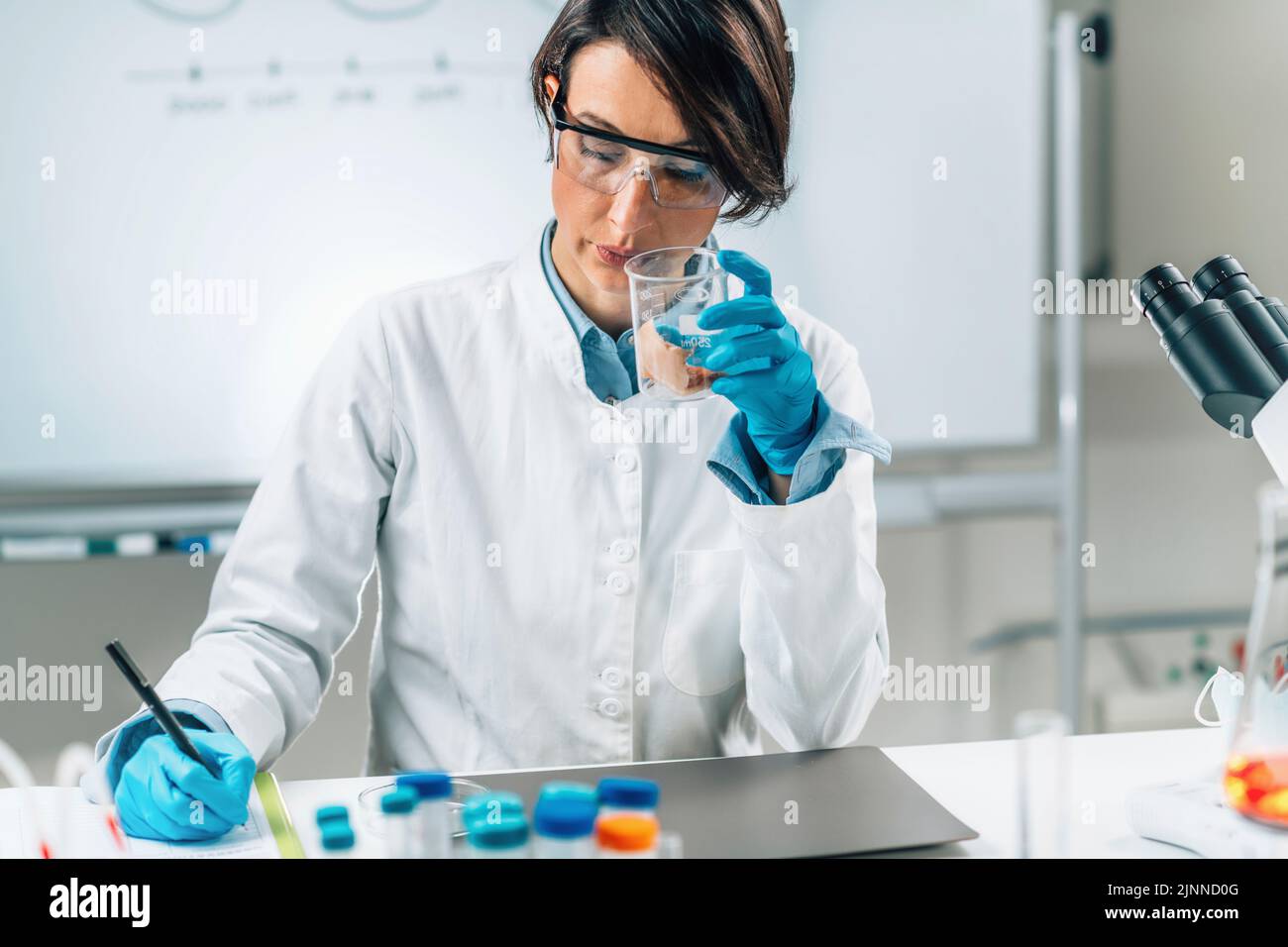 Quality control inspector testing fish Stock Photo - Alamy