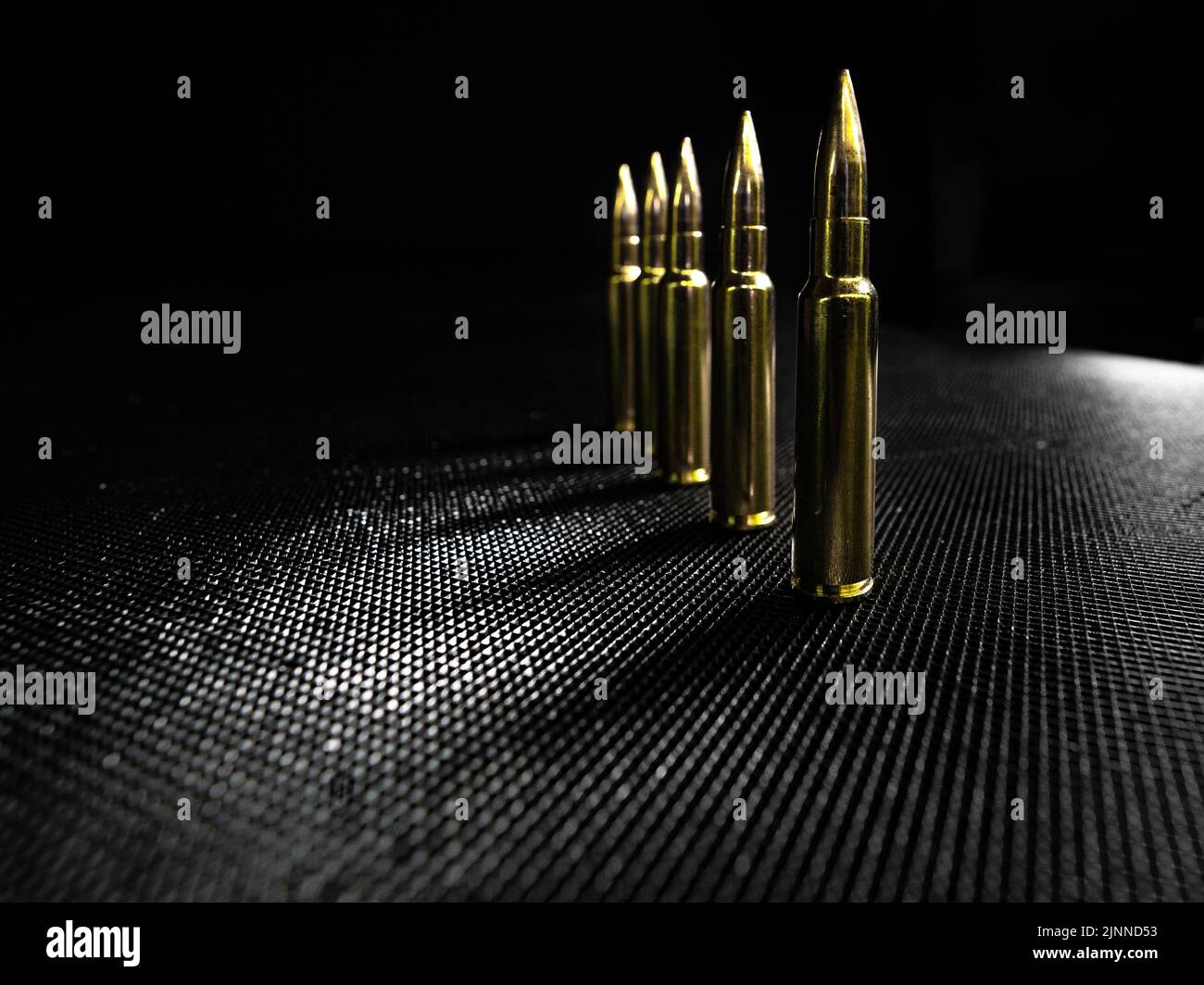 Five gun shells of a gun on a black background, Germany Stock Photo - Alamy