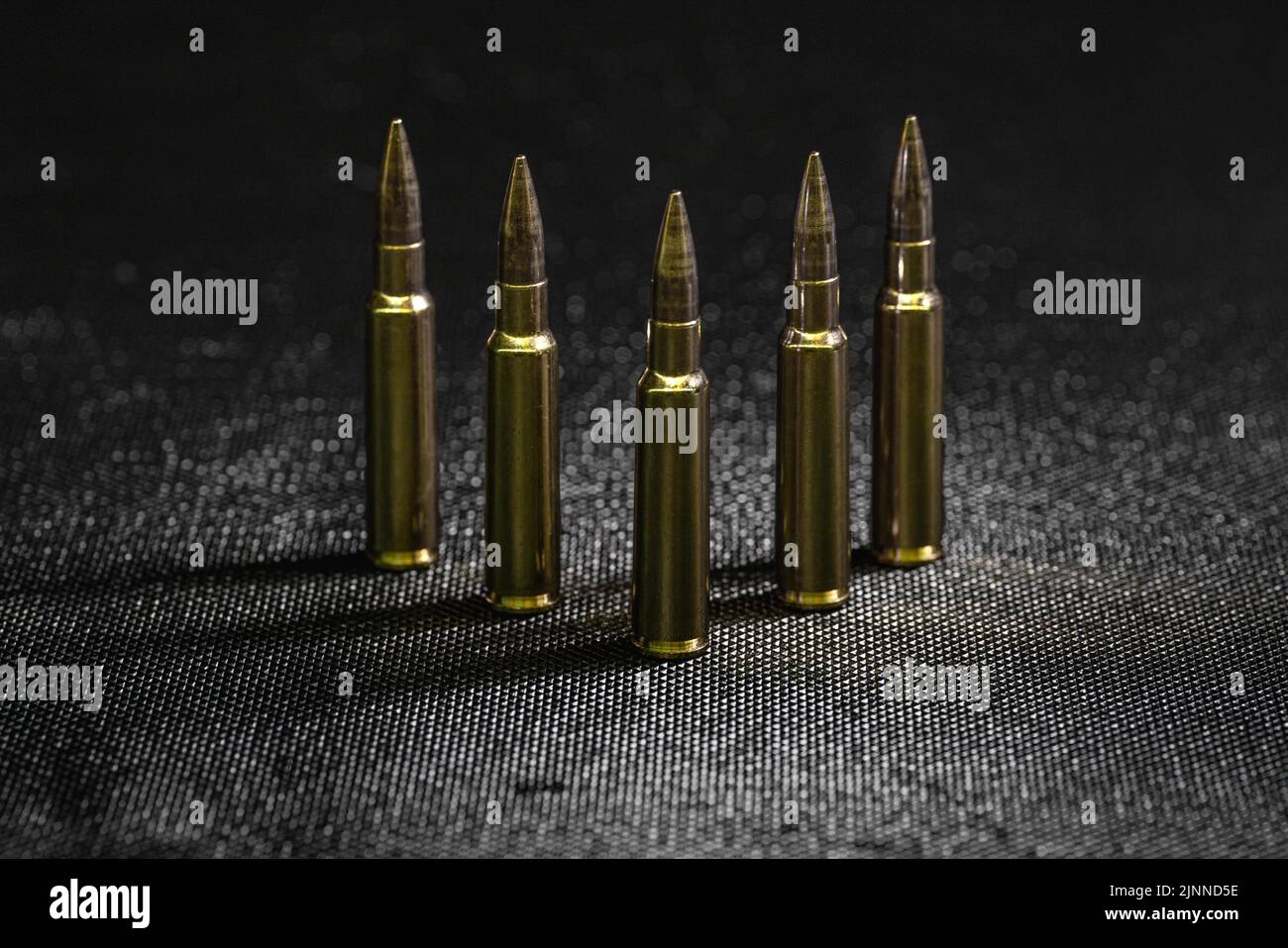 Five gun shells of a gun on a black background, Germany Stock Photo - Alamy