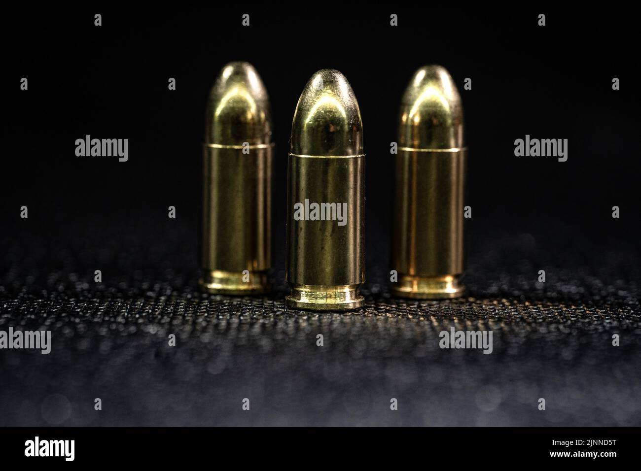 Three gun shells of a gun on a black background, Germany Stock Photo ...