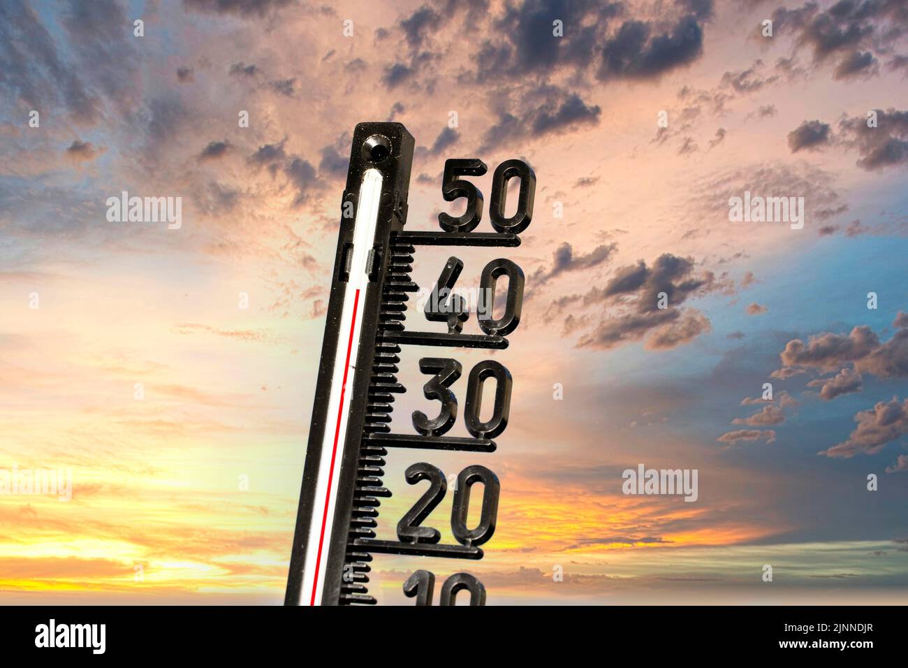 Symbolic image of the heatwave, thermometer at 45 degrees and a glowing ...