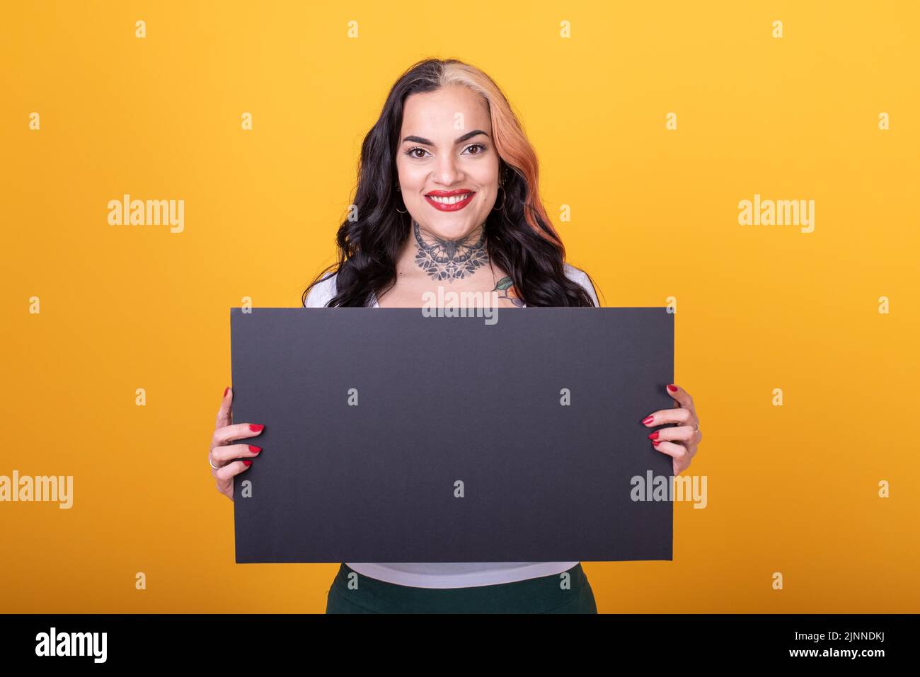 Beautiful woman holding sign hi-res stock photography and images - Alamy