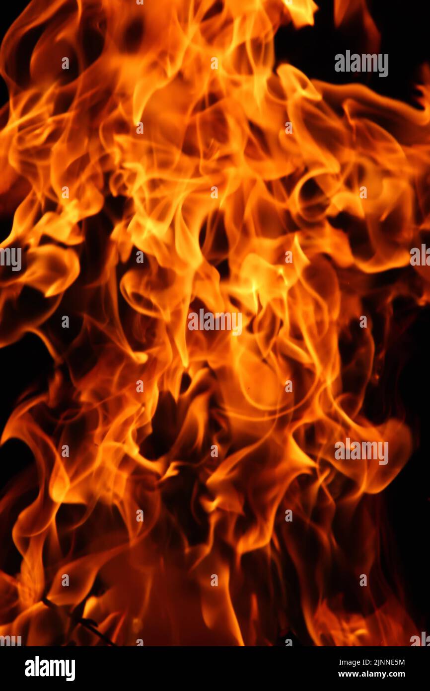 Wild fire burns red orange. Image-filling shot Stock Photo - Alamy