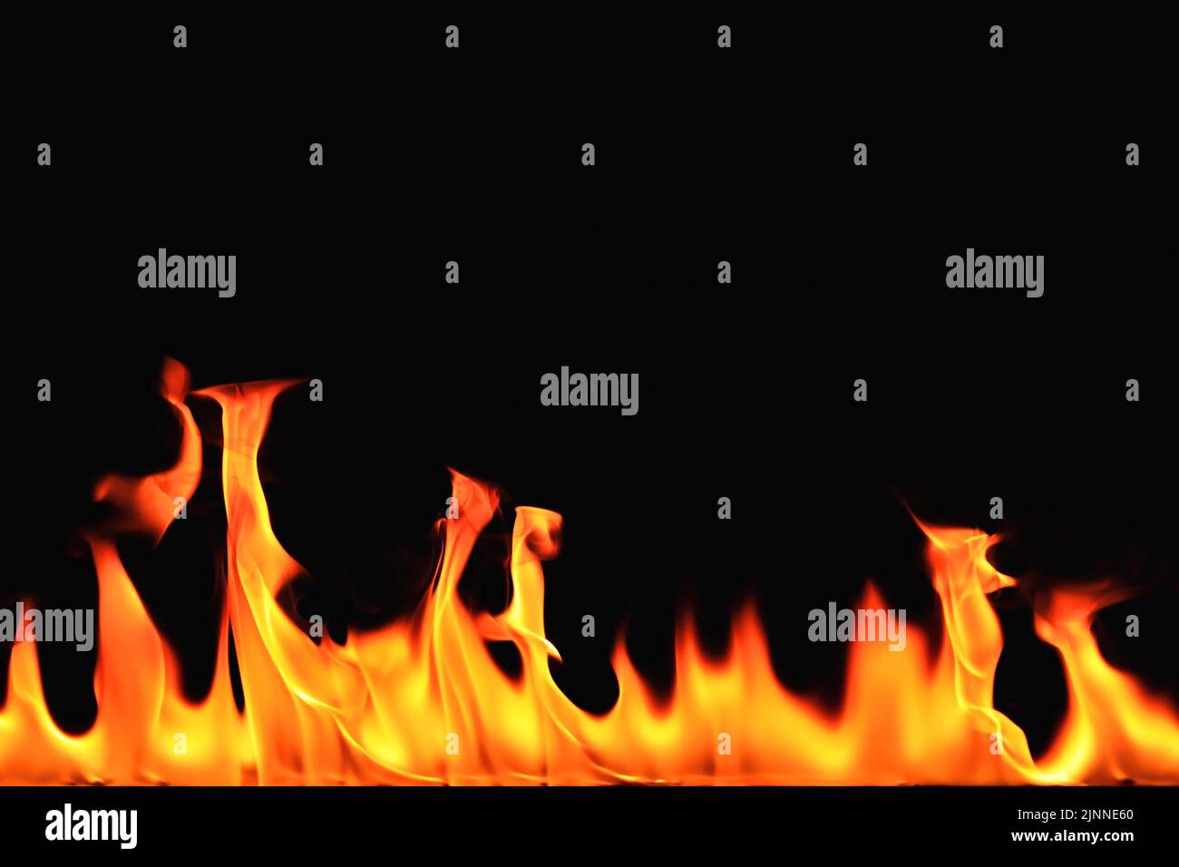 Fire in a flame rail. Ribbon of flame cut out against a black ...