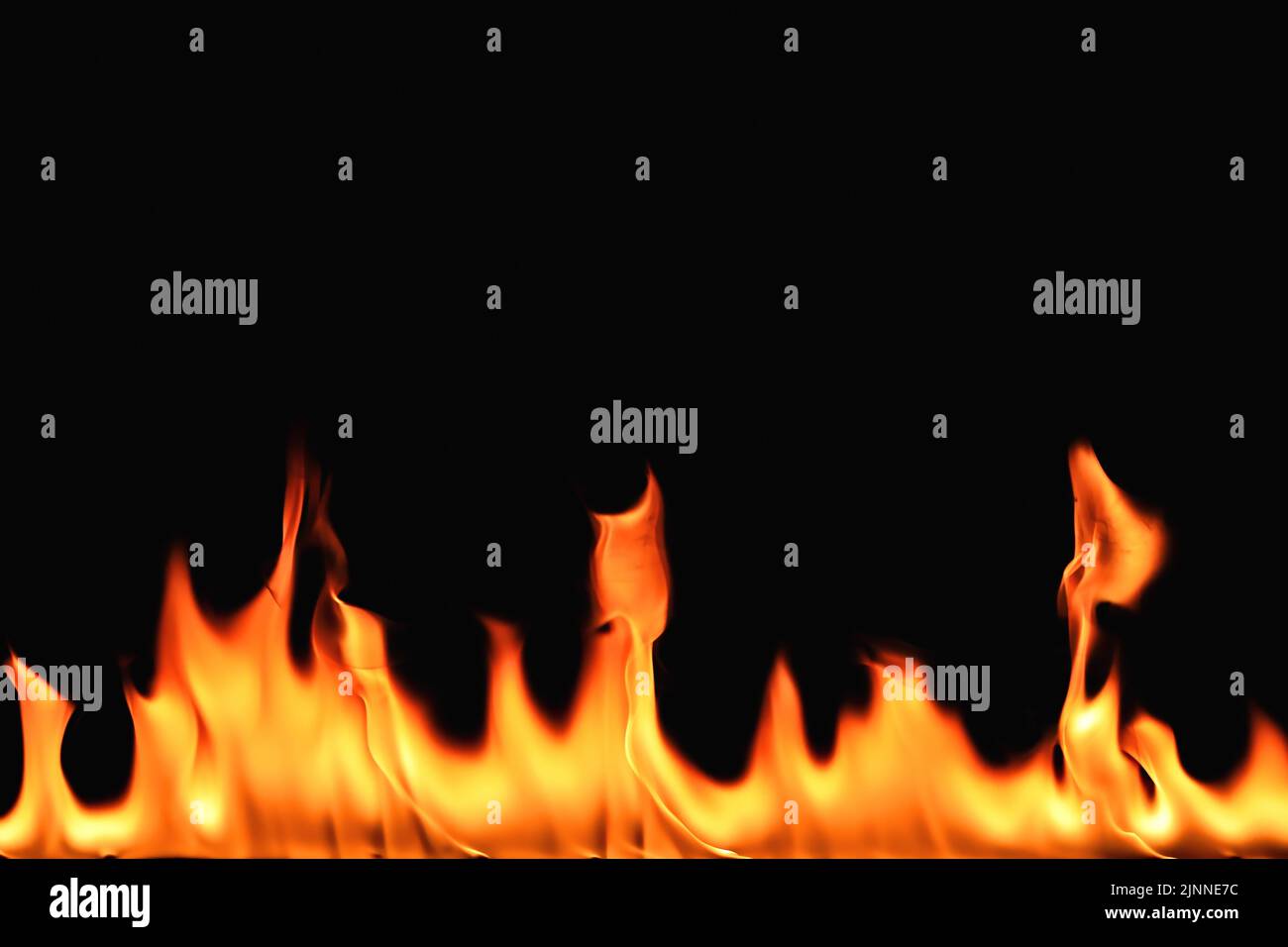 Fire in a flame rail. Ribbon of flame cut out against a black ...