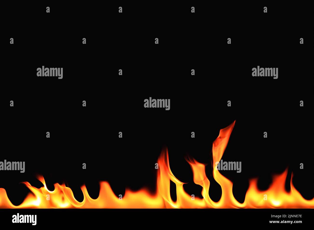 Fire in a flame rail. Ribbon of flame cut out against a black ...