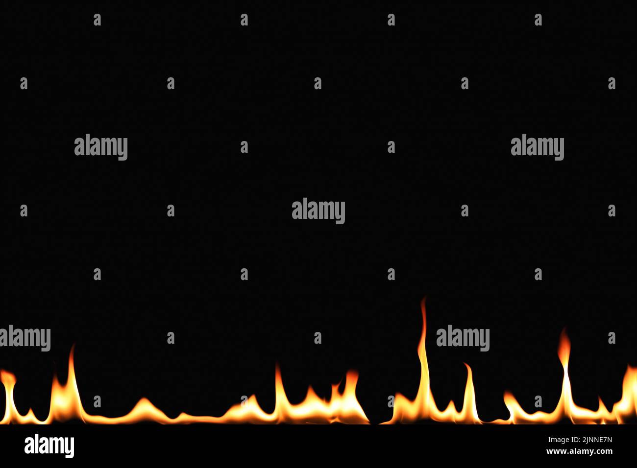 Fire in a flame rail. Ribbon of flame cut out against a black ...