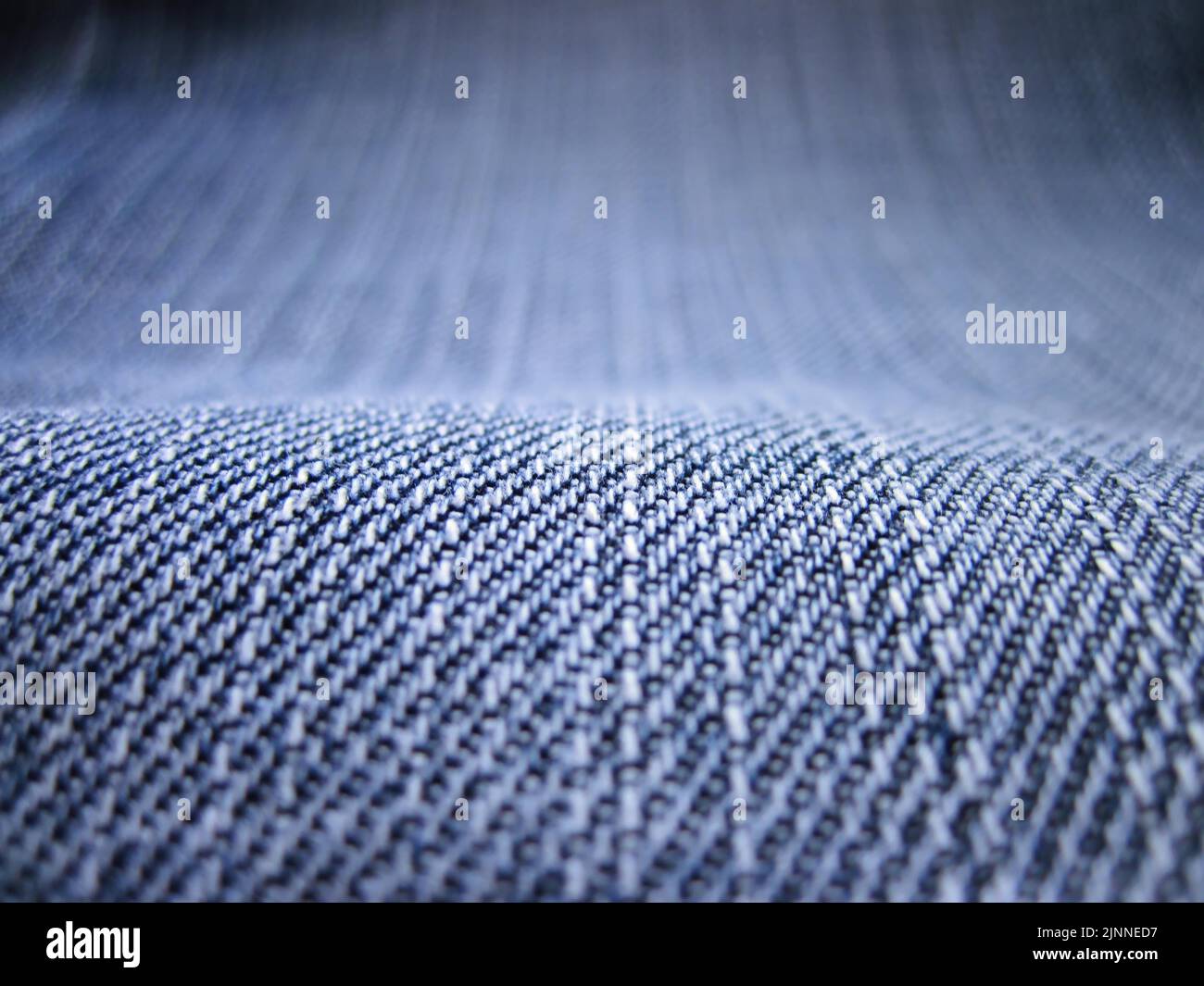 Denim jeans as blue background. Depicted with depth of field to fill ...