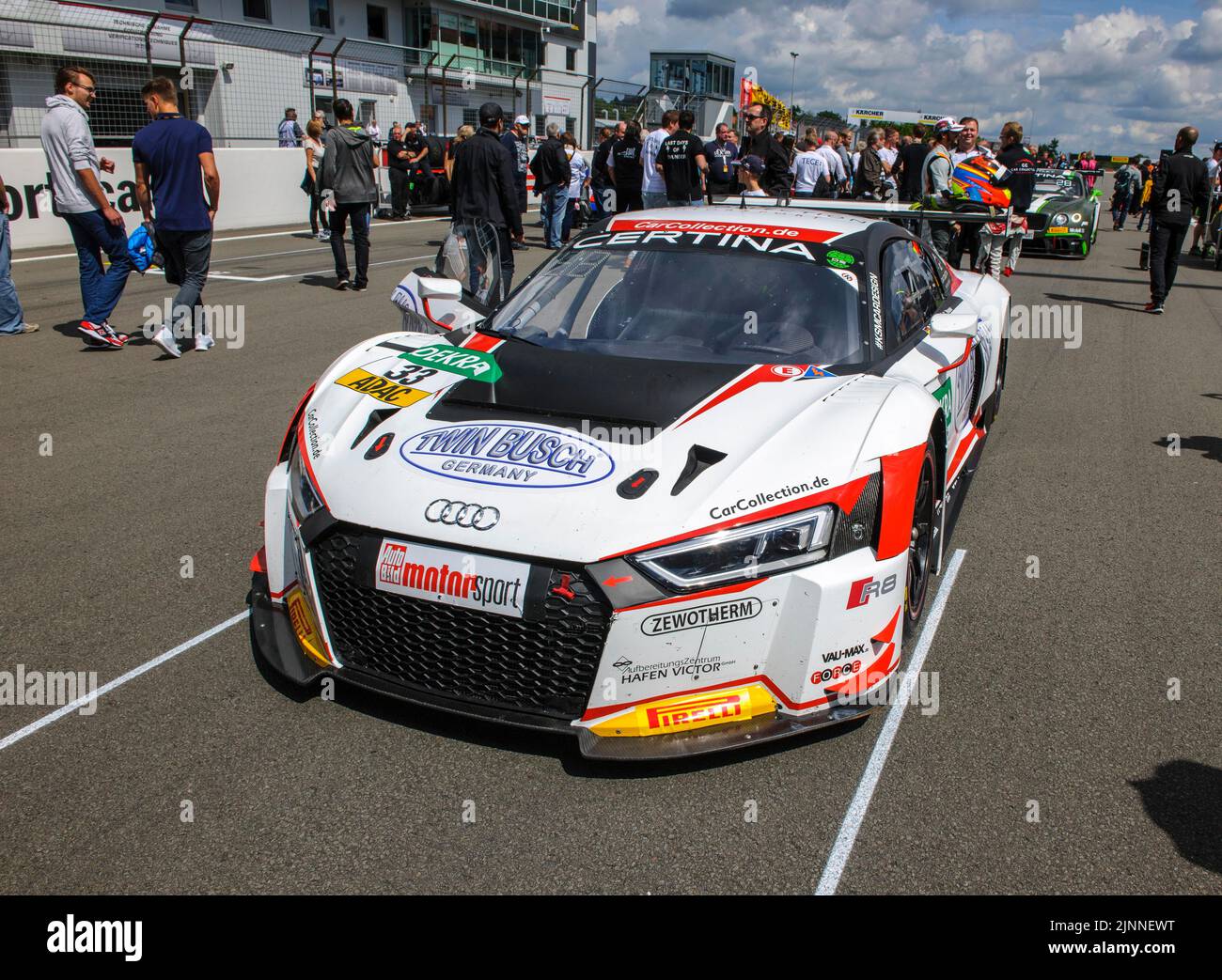 Audi R8 race car on grid in gridlane on start-finish straight of race ...