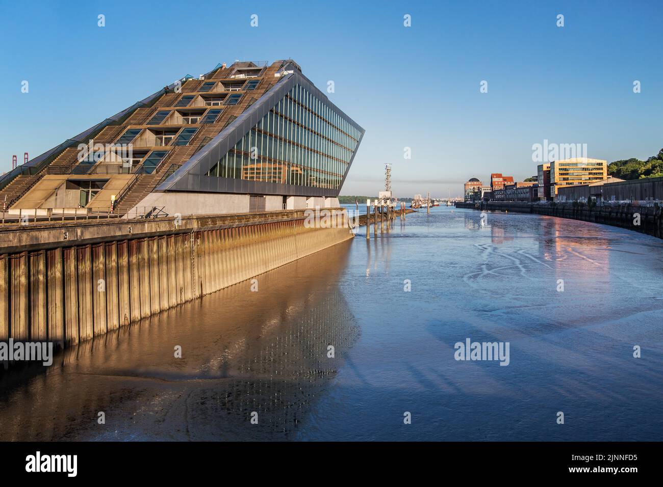Dockland office building in the early morning sun on the Elbe in the ...