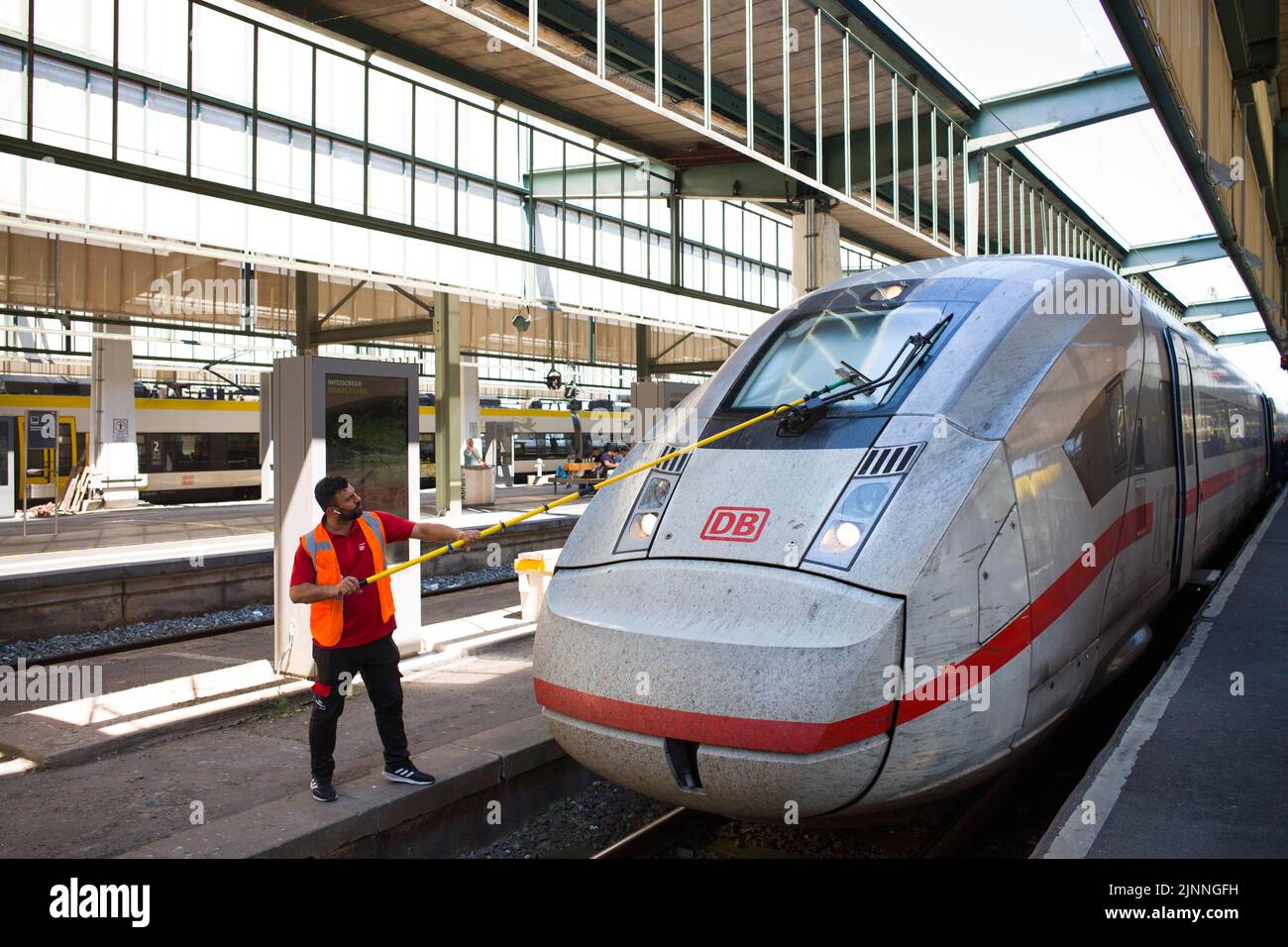 Service worker cleans windscreen of an Intercity Express, ICE, main ...