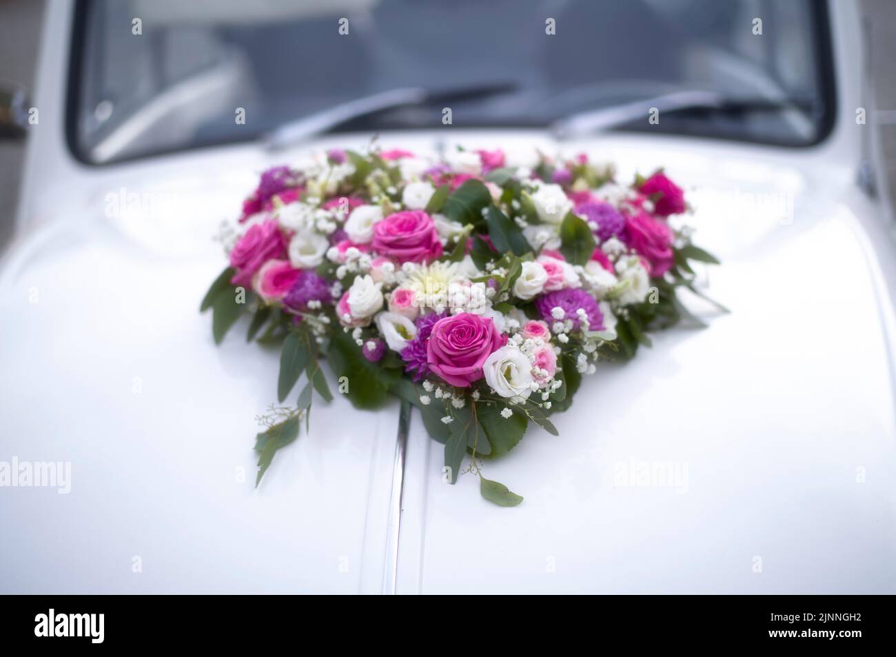 Flower heart, flower decoration on decorated wedding car, bridal car ...