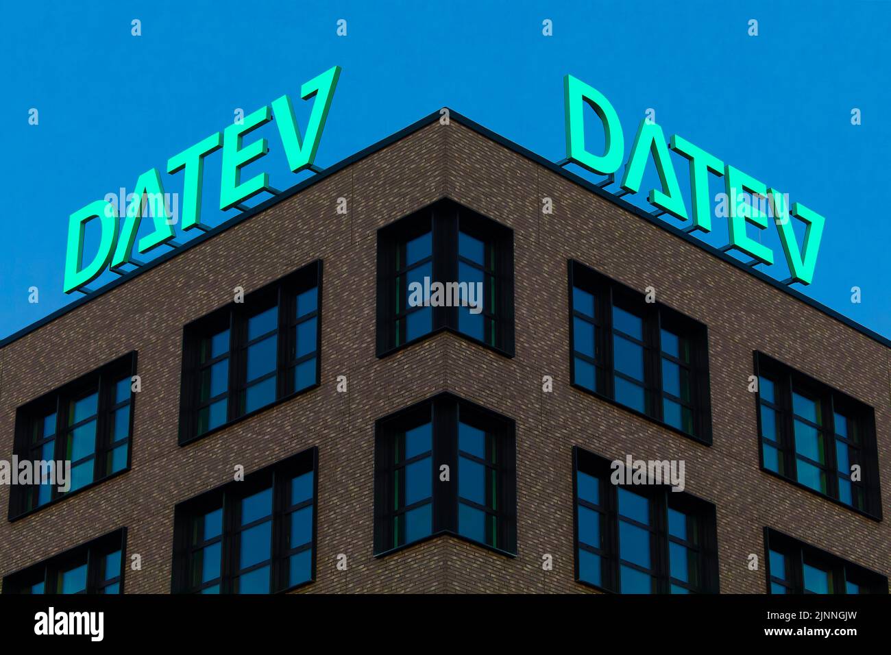 Datev Cube building, logo, trademark, brand, illuminated, evening ...