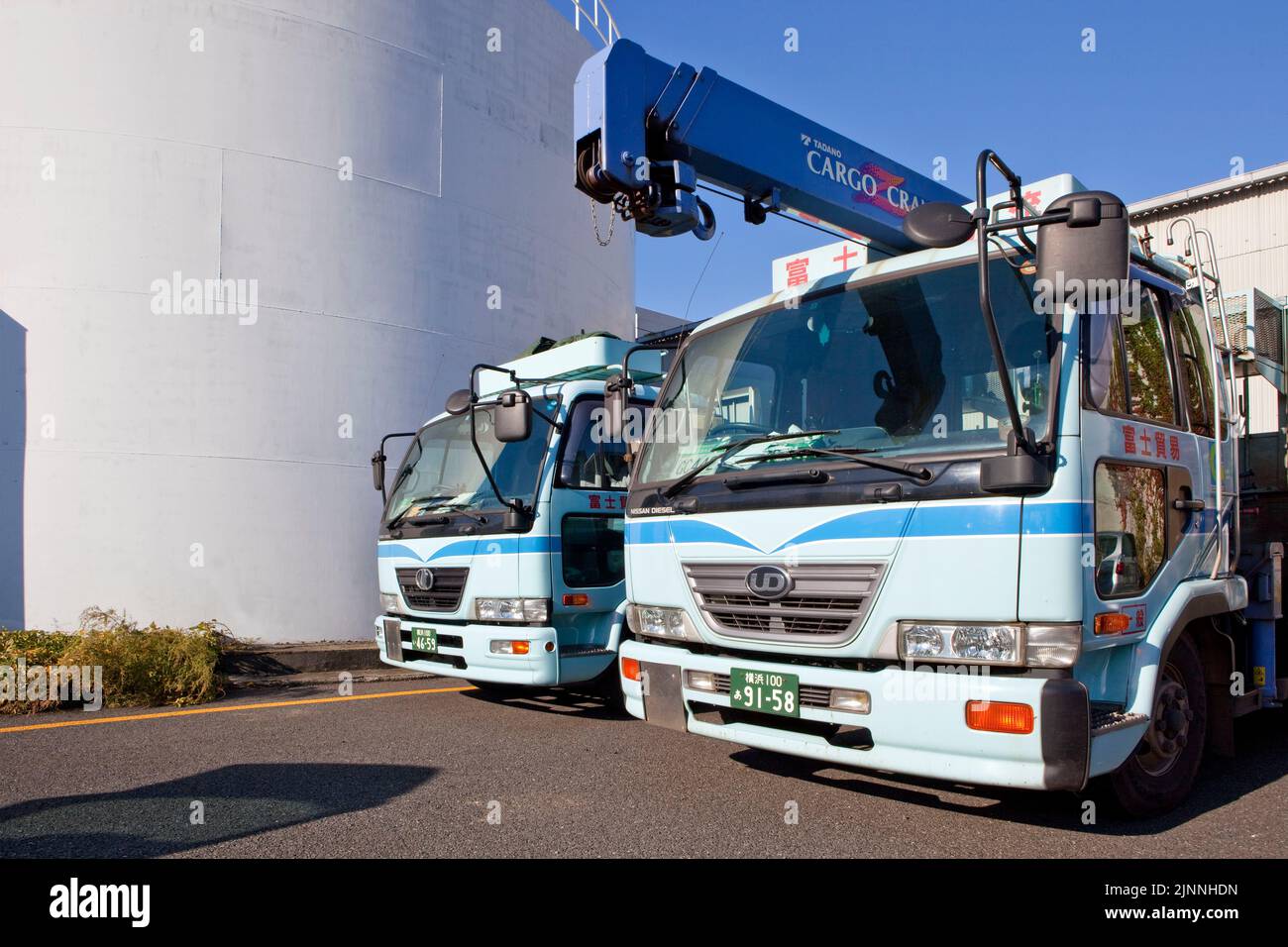 Utility trucks port Tokyo Japan Stock Photo - Alamy
