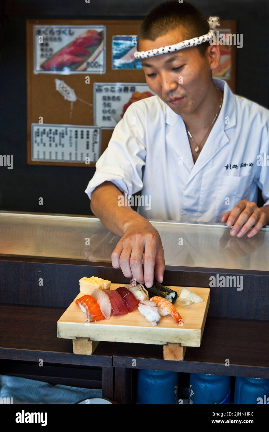 Young sushi chef Tsukiji Market Tokyo Japan Stock Photo - Alamy