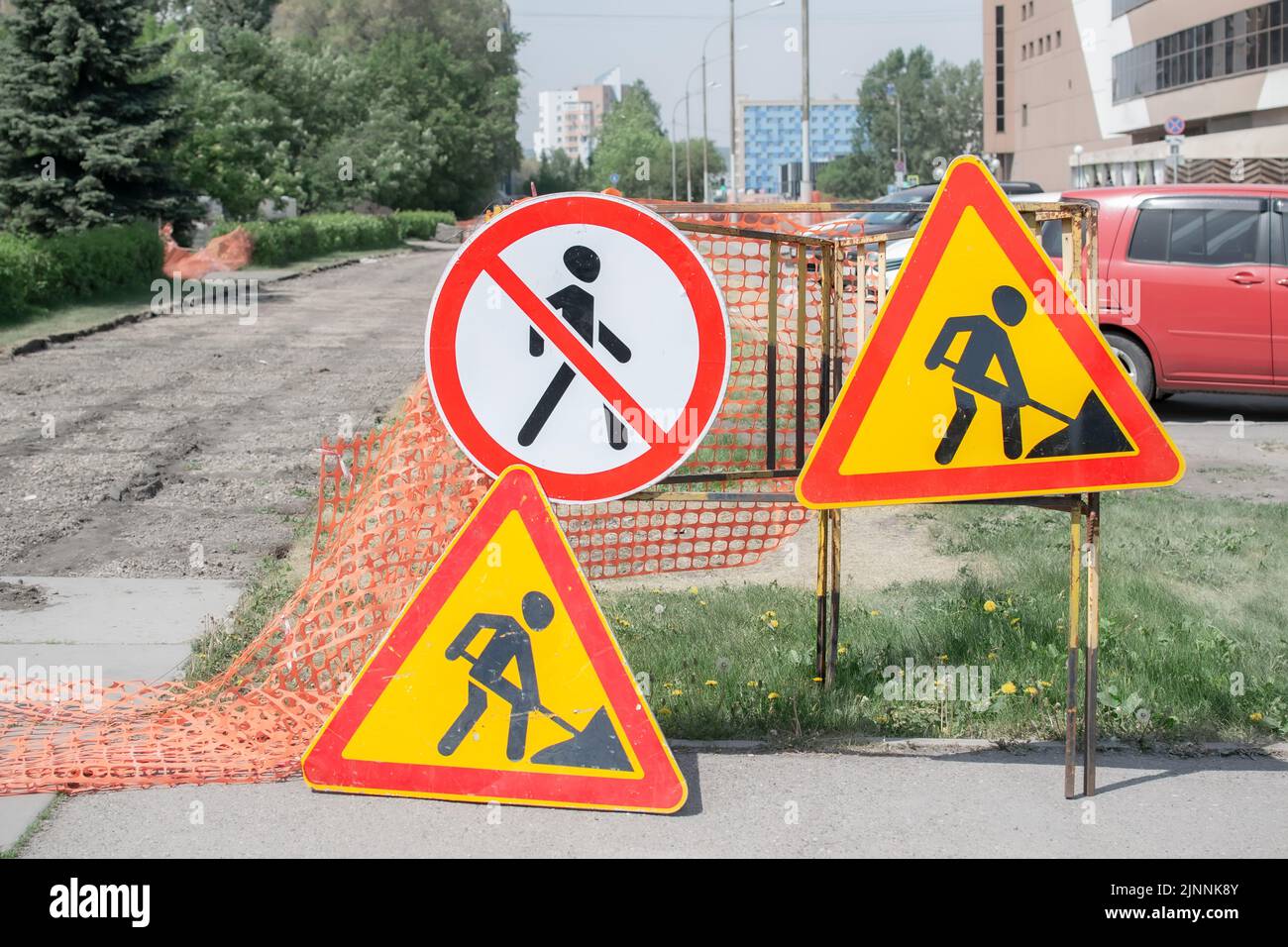road signs of the ongoing repair work of the sidewalk Stock Photo - Alamy