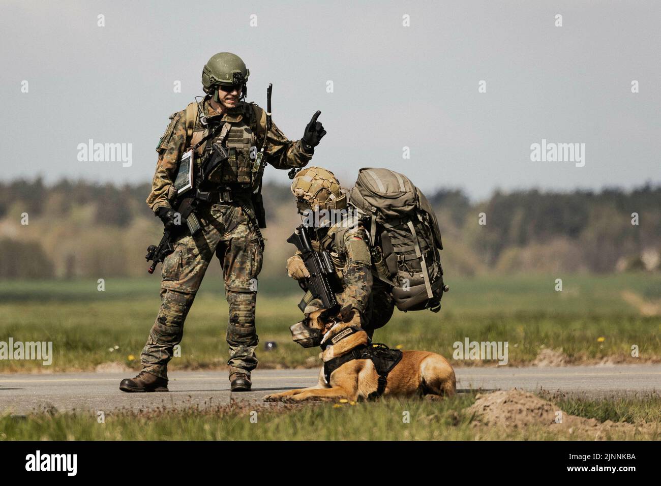 Bundeswehr soldiers and an operational dog, photographed as part of the ...