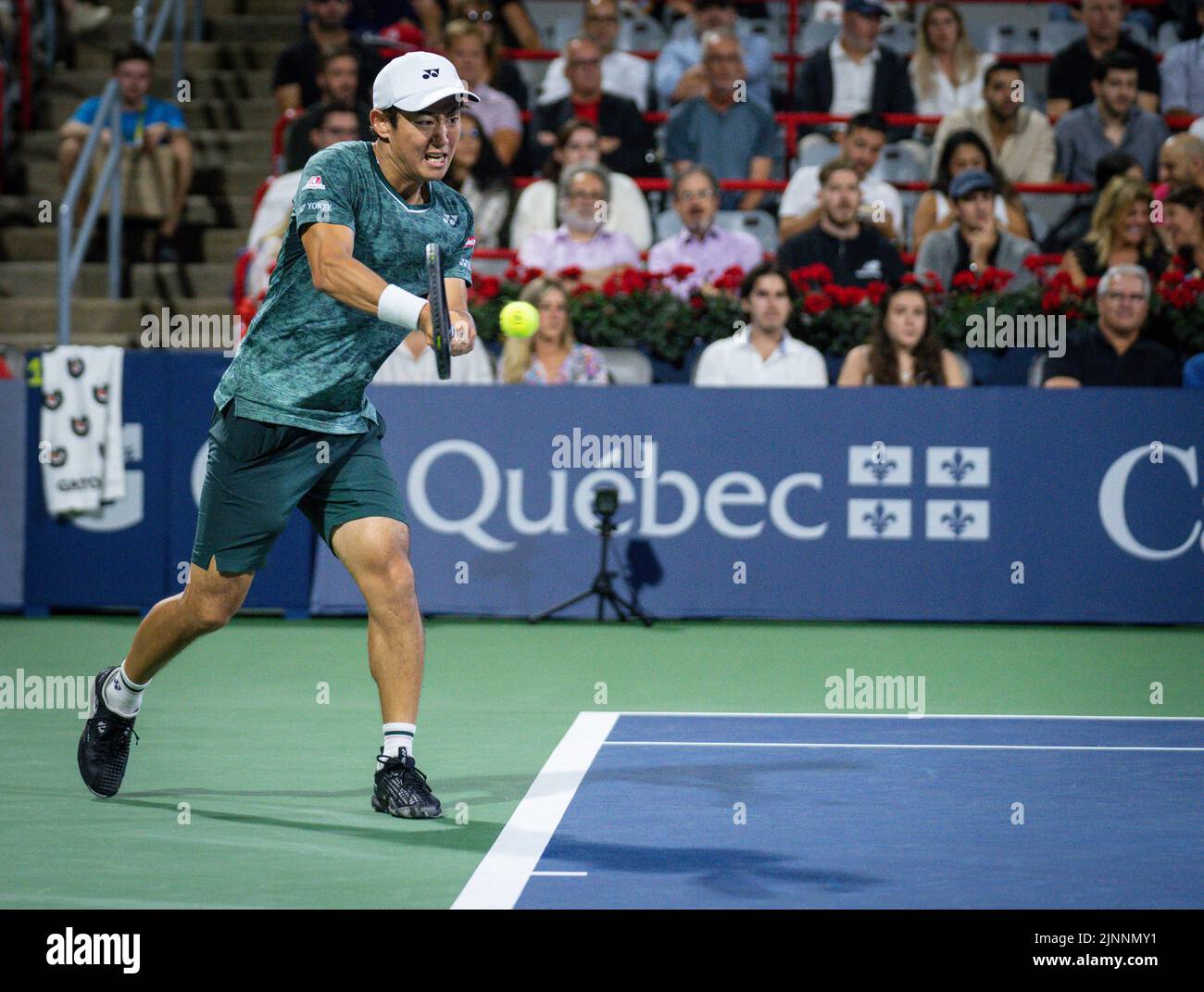 Yoshihito Nishioka of Japan hits a shot during the National Bank Open ...
