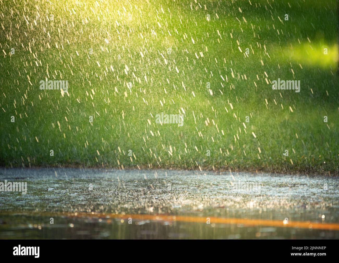 Raindrops falling on city asphalt hi-res stock photography and images ...