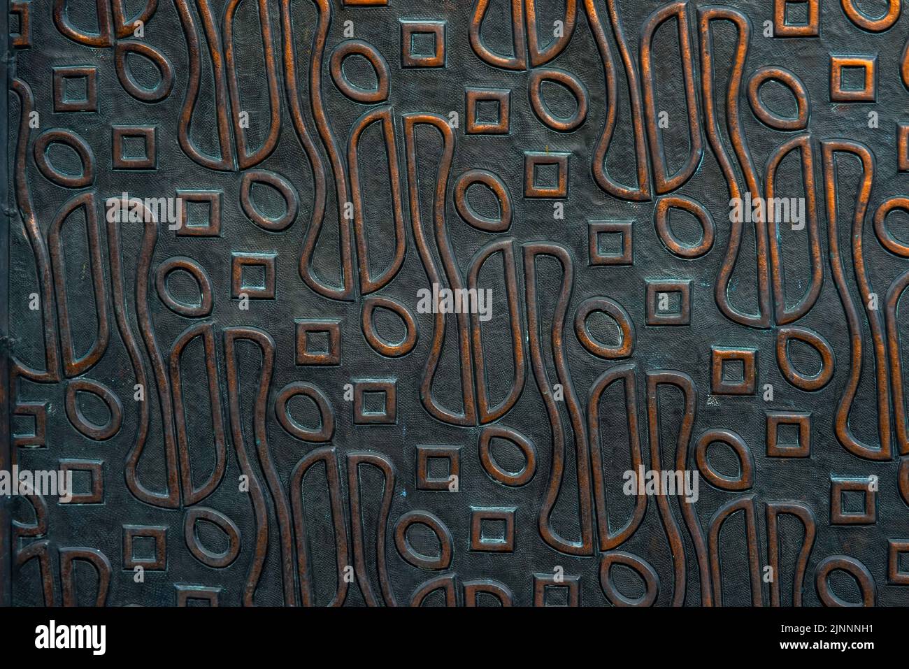 Traditional indonesian batik textured on steel. wall of steel is carved ...